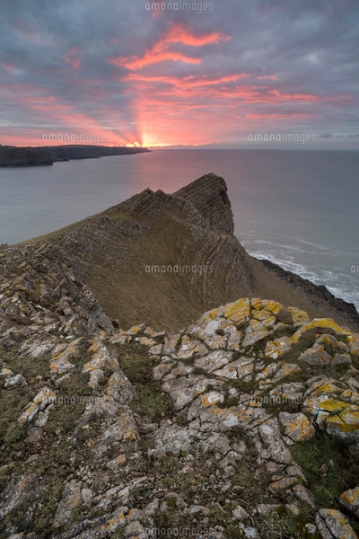 View towards Fall Bay and Mewslade Bay, at sunrise, Gower Peninsula ...
