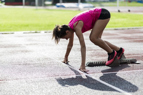 Teenage runner training on race track, laughingの写真素材 [FYI04364097 ...